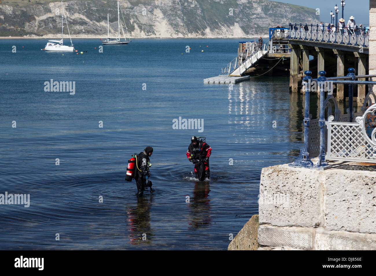 Divers in sea at Swanage Pier, Dorset Stock Photo - Alamy