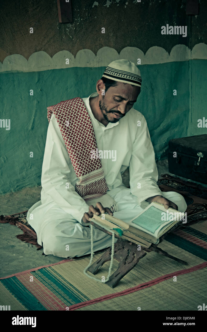Person reading arabic book hi-res stock photography and images - Alamy