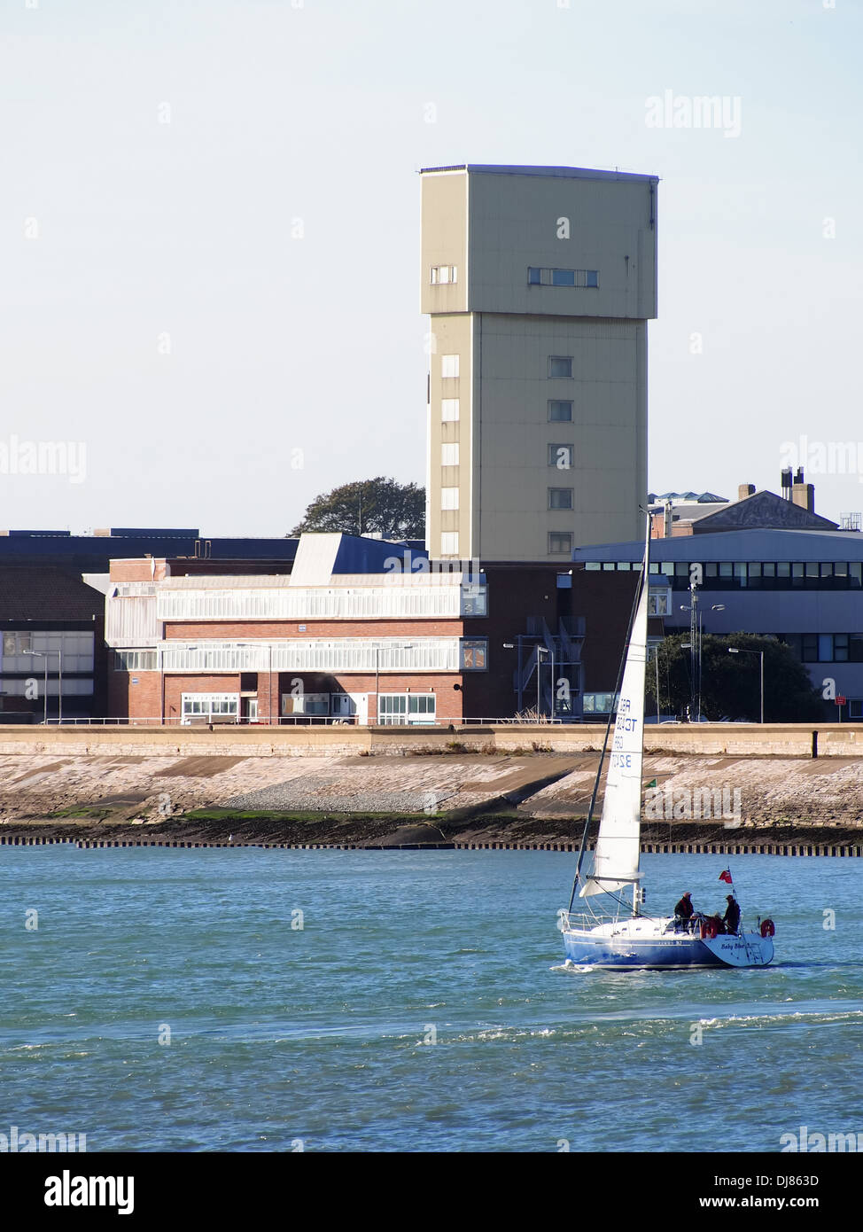 A sailing boat in Portsmouth Harbour, with the submarine escape tank ...