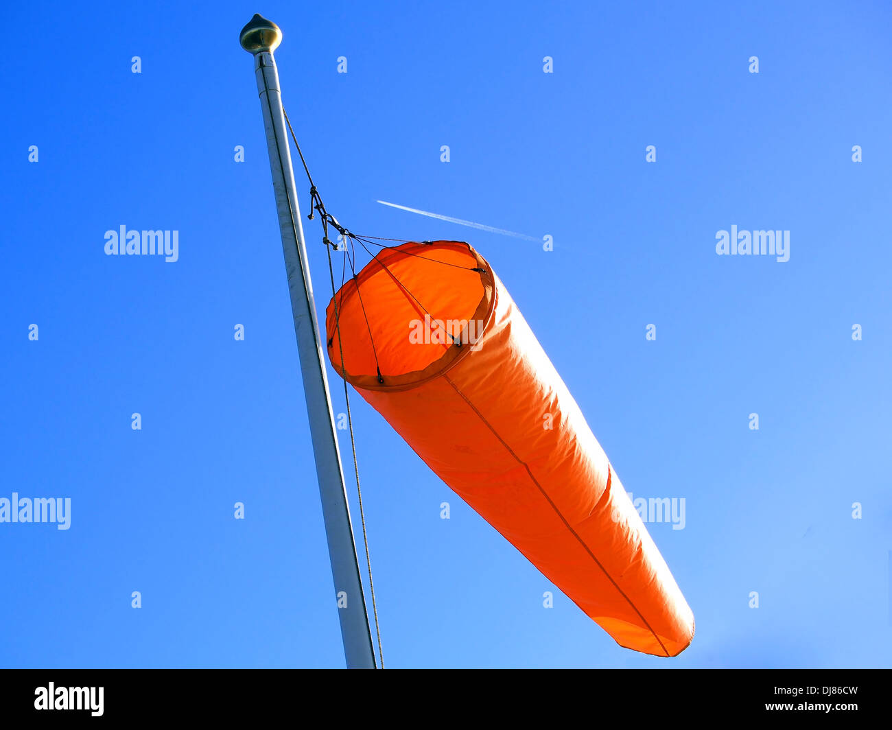 Bright orange windsock hi-res stock photography and images - Alamy
