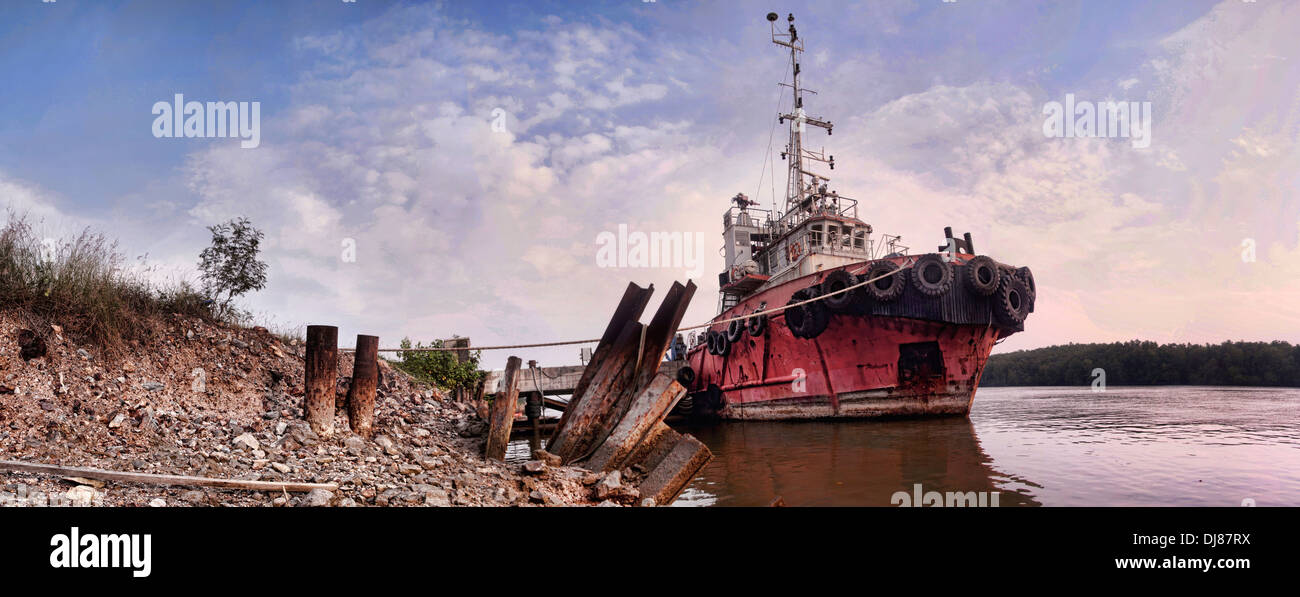 supply boat berthing at river Stock Photo - Alamy