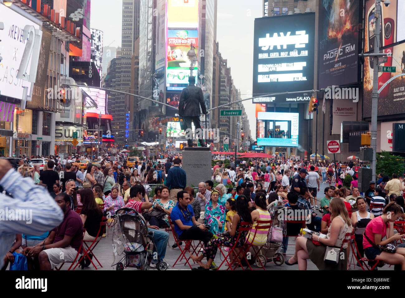 Throngs of people move this way and that, and some just sit, in Times ...