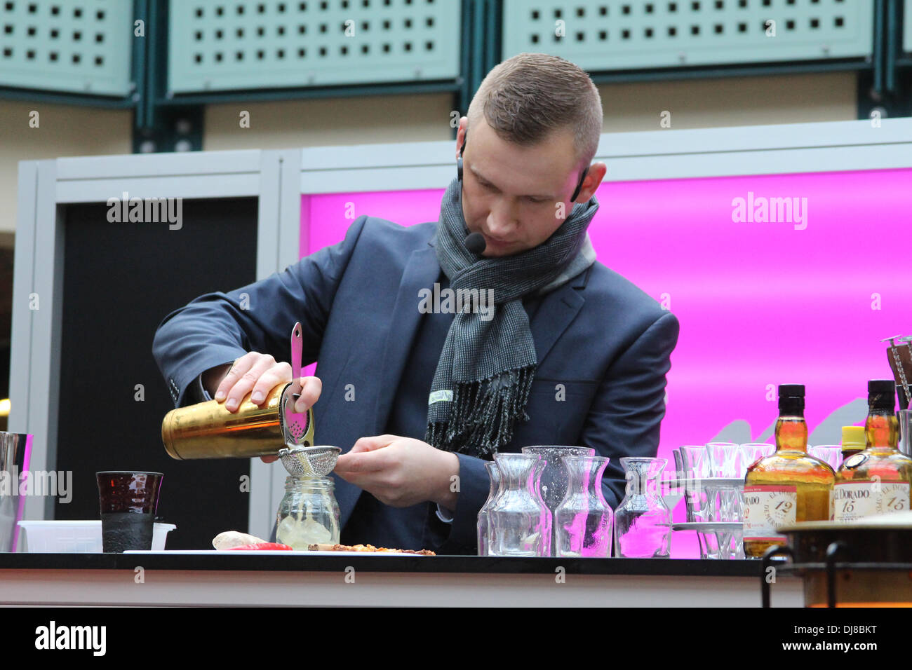 A man demonstrating how to mix a cocktail Stock Photo - Alamy