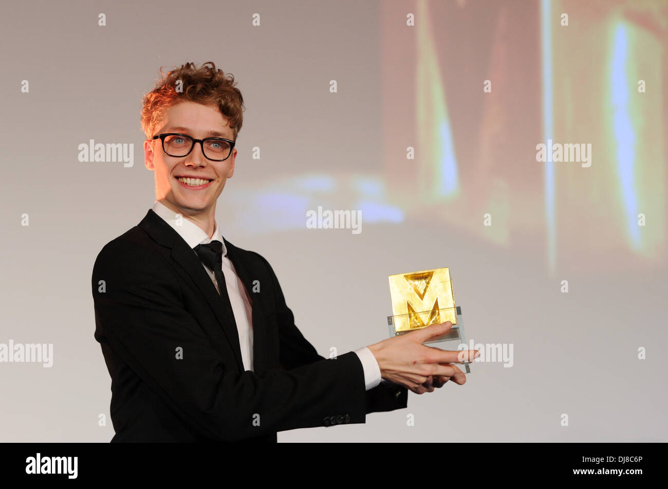 Munich, Germany. 24th Nov, 2013. Actor Julius Feldmeier poses with the ...