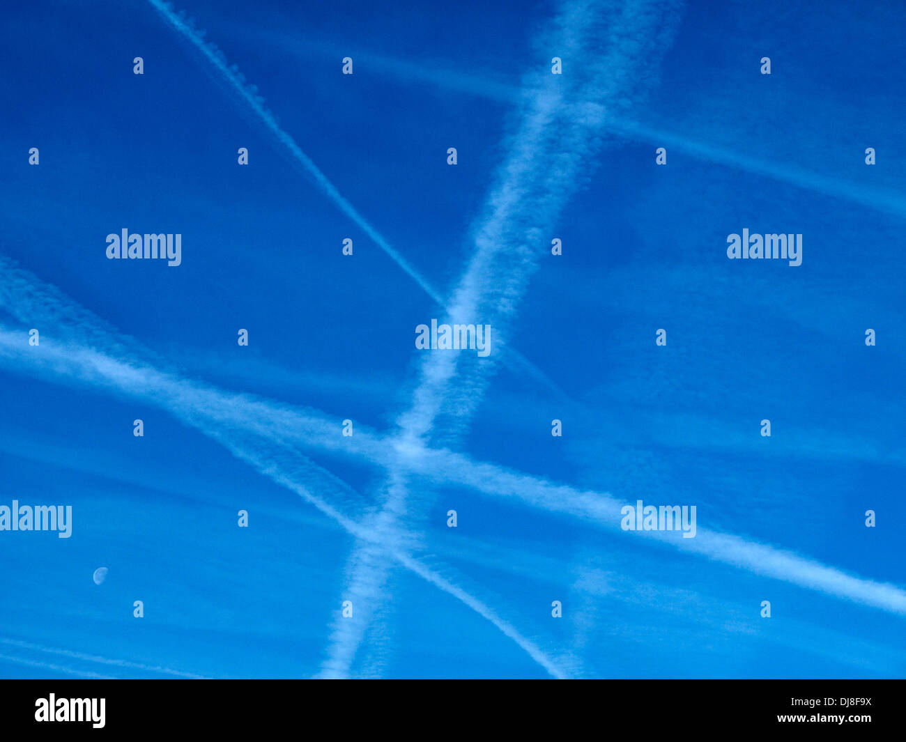 Vapor trails with deep blue sky Stock Photo - Alamy
