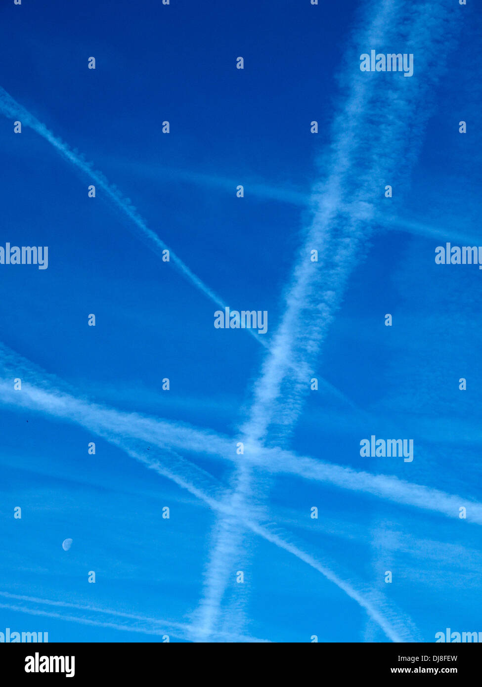 Vapor trails with deep blue sky Stock Photo - Alamy