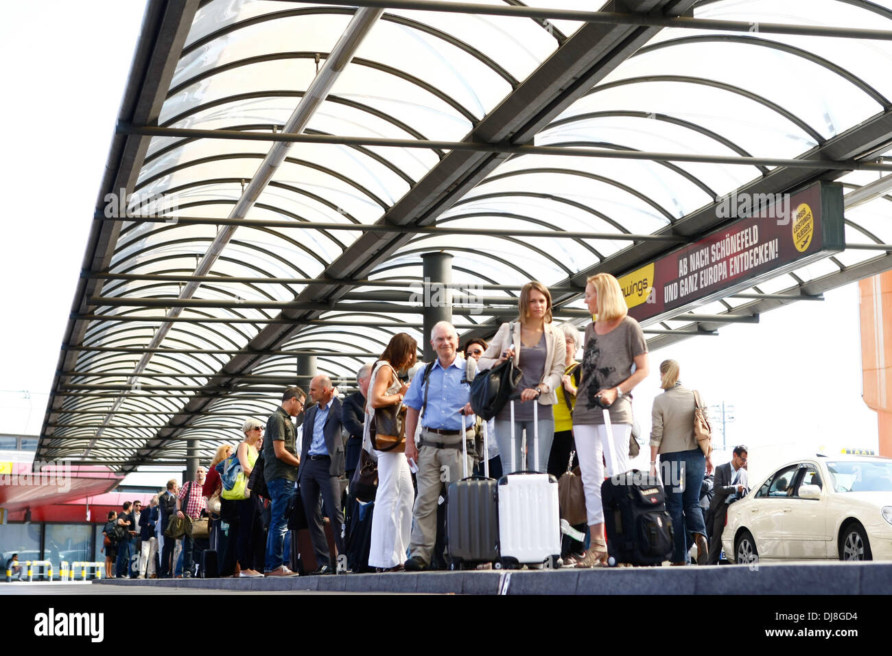 Passengers waiting for long periods of time in line for taxis at Tegel airport. Berlin, Germany ...