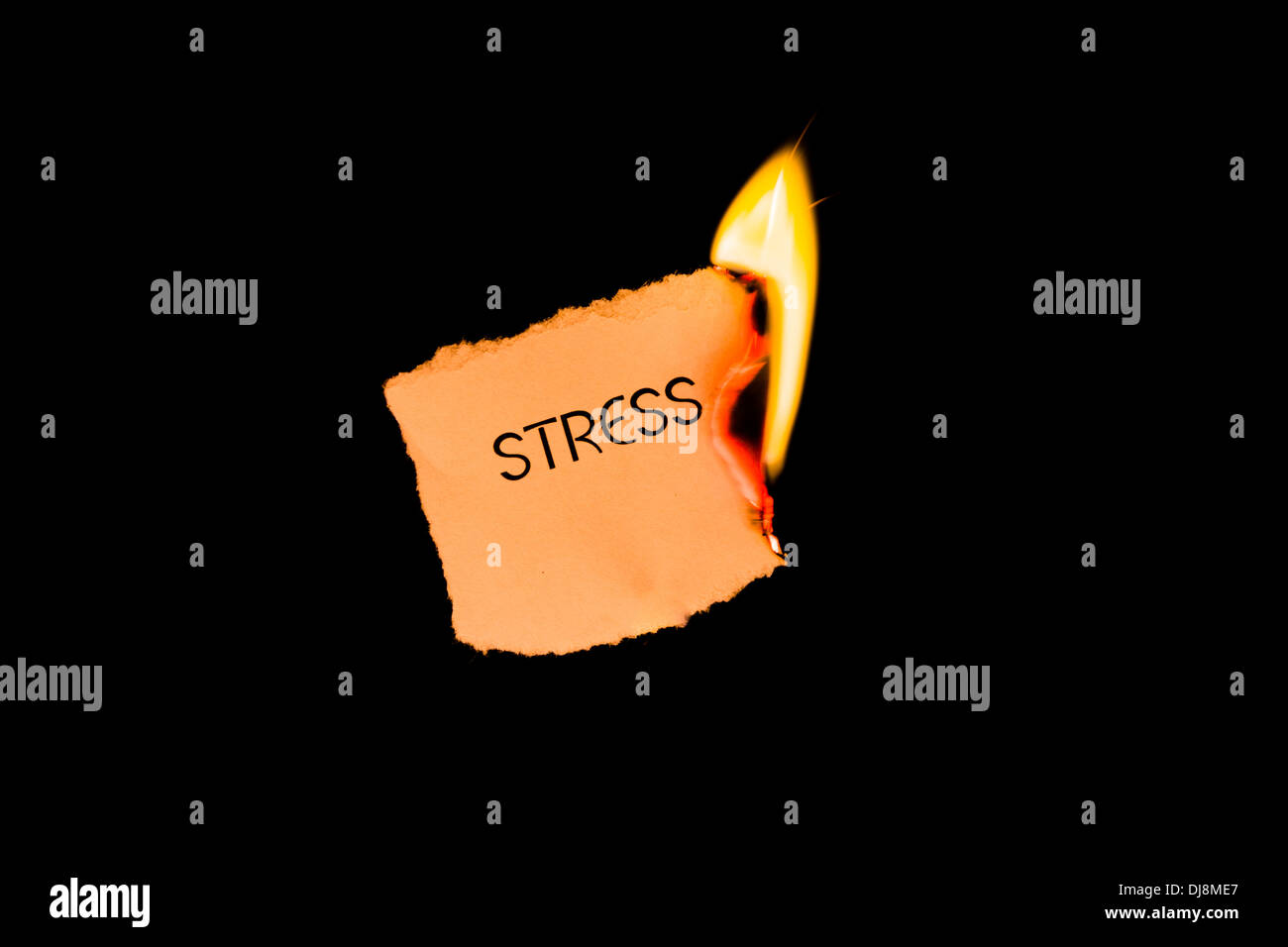 A piece of paper with the word "stress" on it is burning. The ...