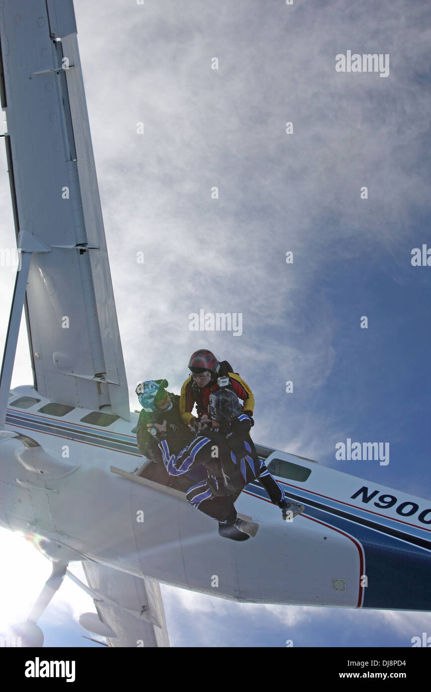 This freefly skydiving team jumped out of an aircraft and is holding ...