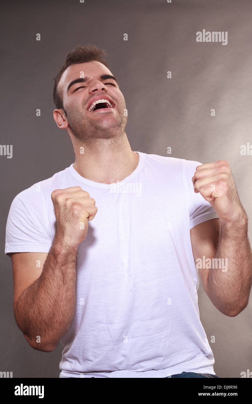 Portrait young man cheering hi-res stock photography and images - Alamy