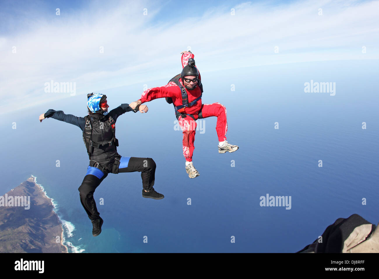 Freefly skydiving team is training formation by holding hands in a sit ...