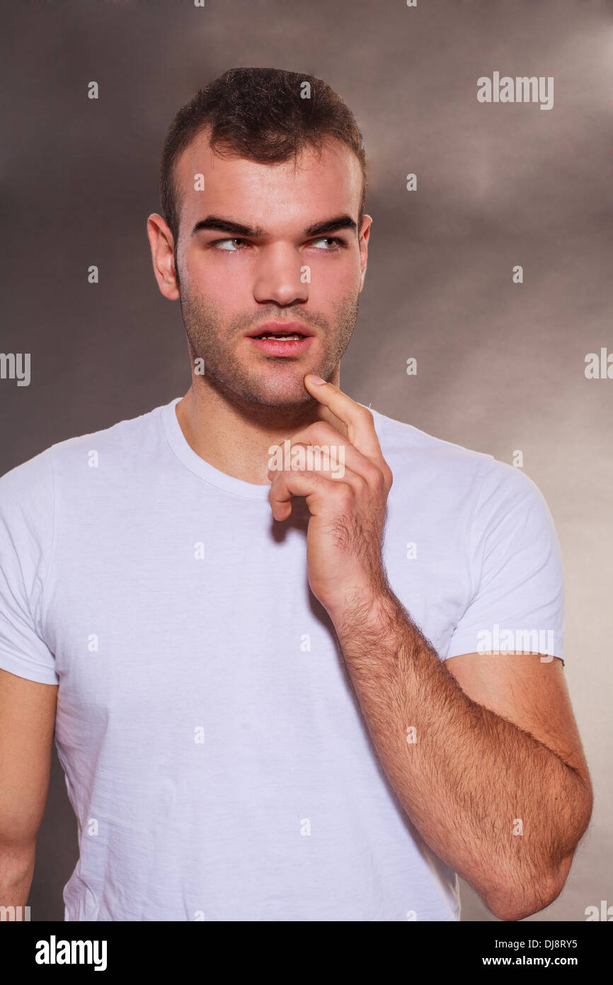 Thoughtful man planning and scheming Stock Photo - Alamy