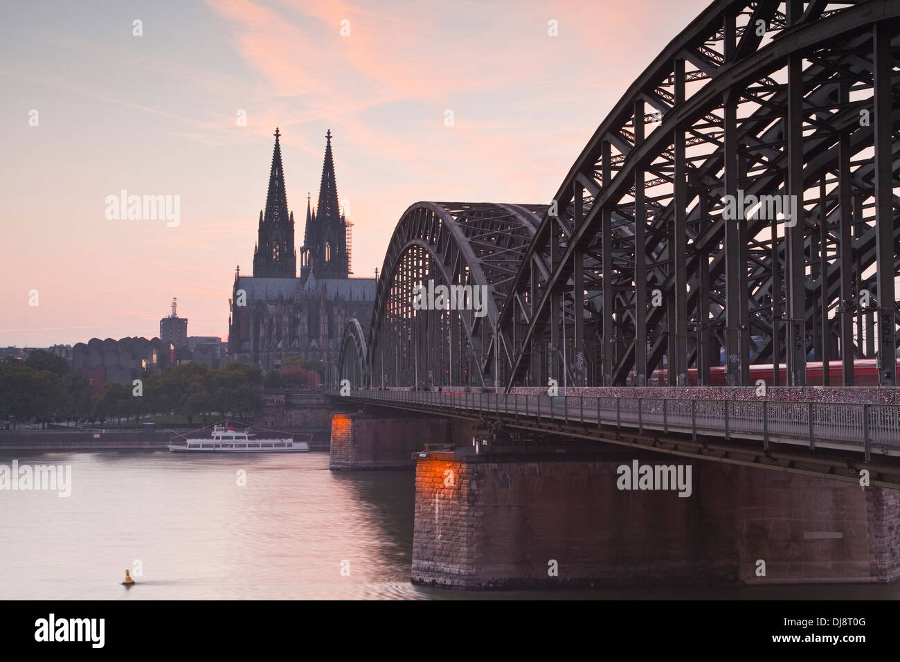 Cologne cathedral and the river Rhine at sunset Stock Photo - Alamy