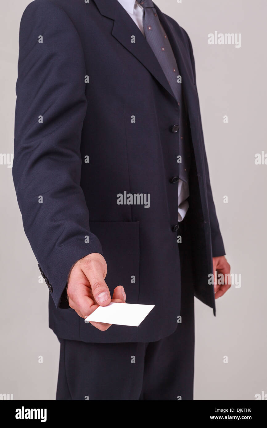 Business executive handing over a card Stock Photo - Alamy