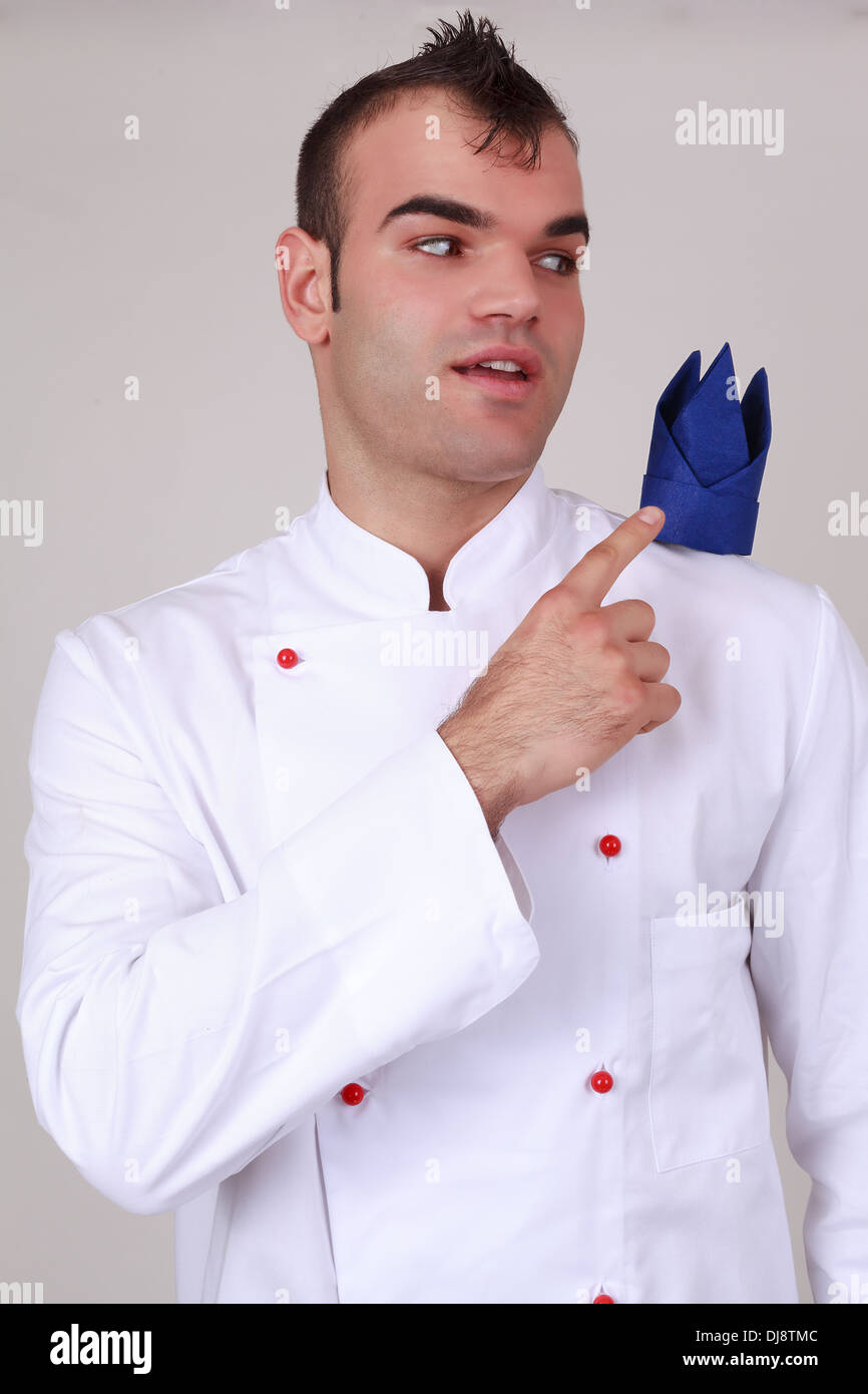Chef pointing to a folded napkin on his shoulder Stock Photo - Alamy
