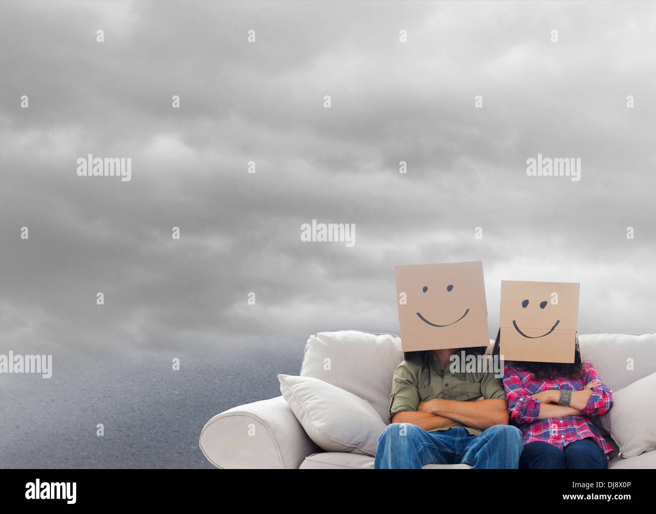 Silly employees with arms folded wearing boxes on their heads Stock ...