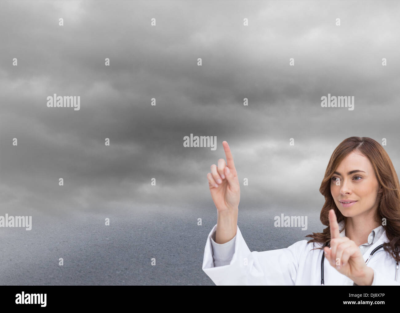 Brunette doctor selecting something with hands Stock Photo - Alamy
