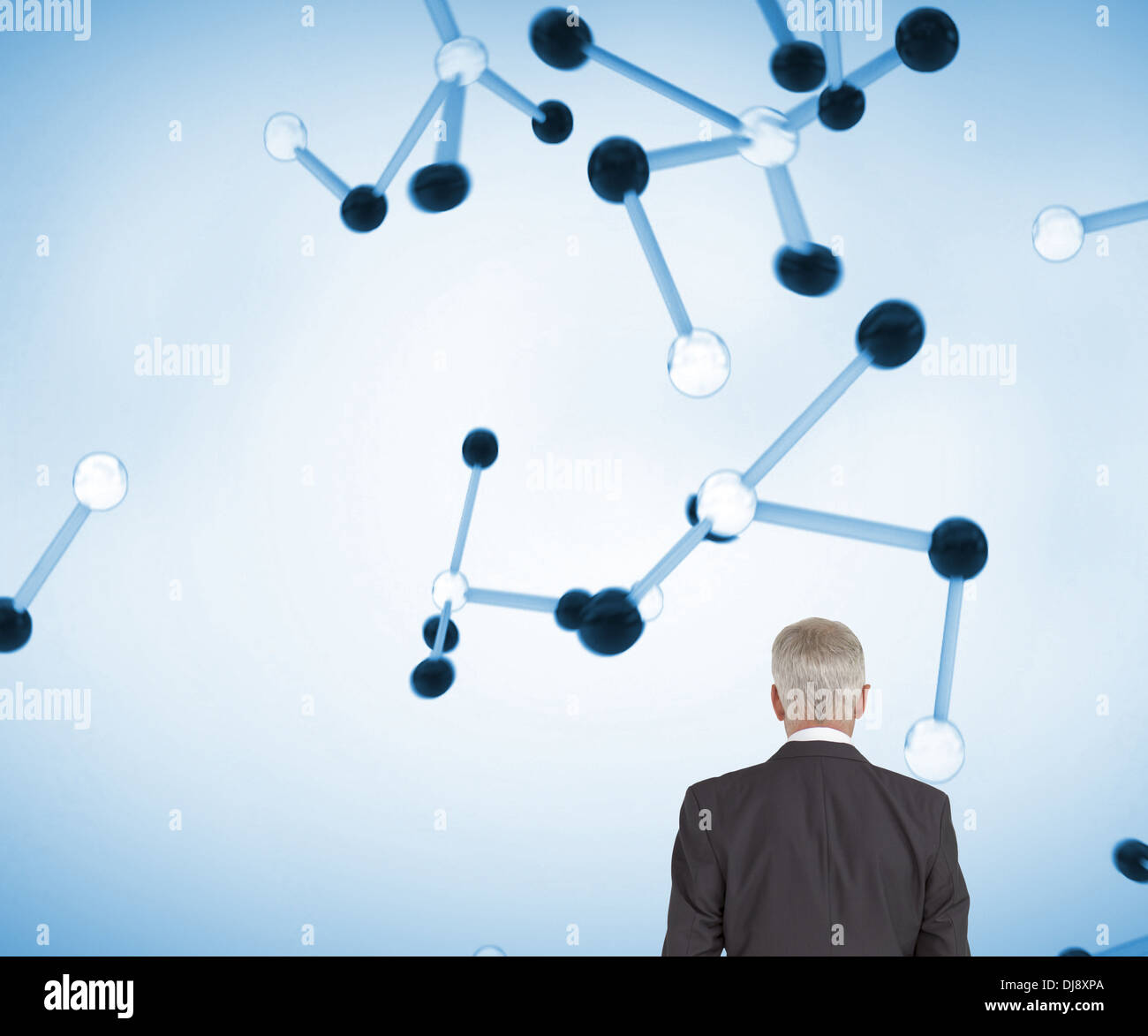 Businessman standing with back to camera Stock Photo - Alamy