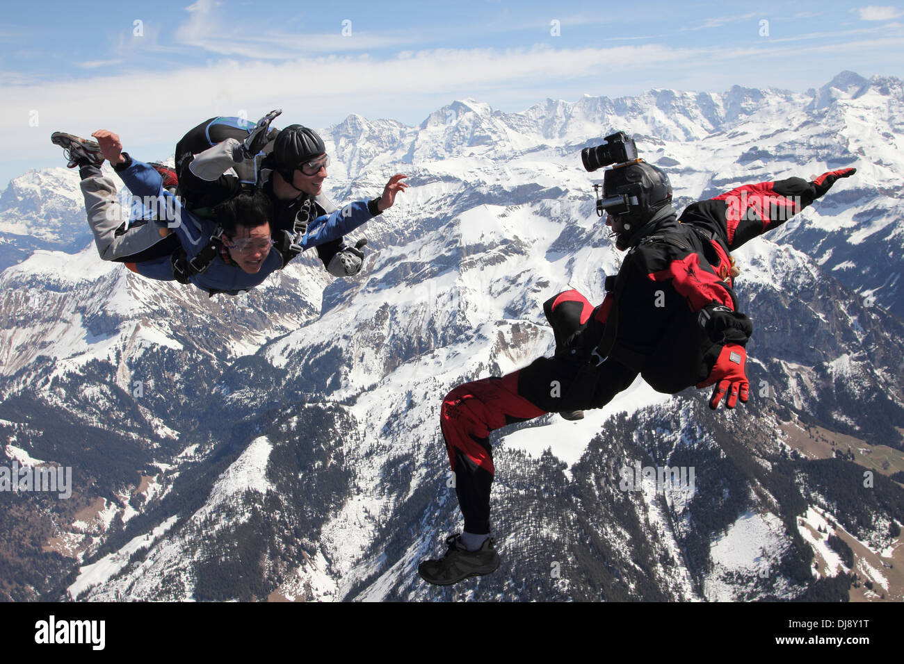Tandem skydiving passengers is having fun during the freefall over a ...