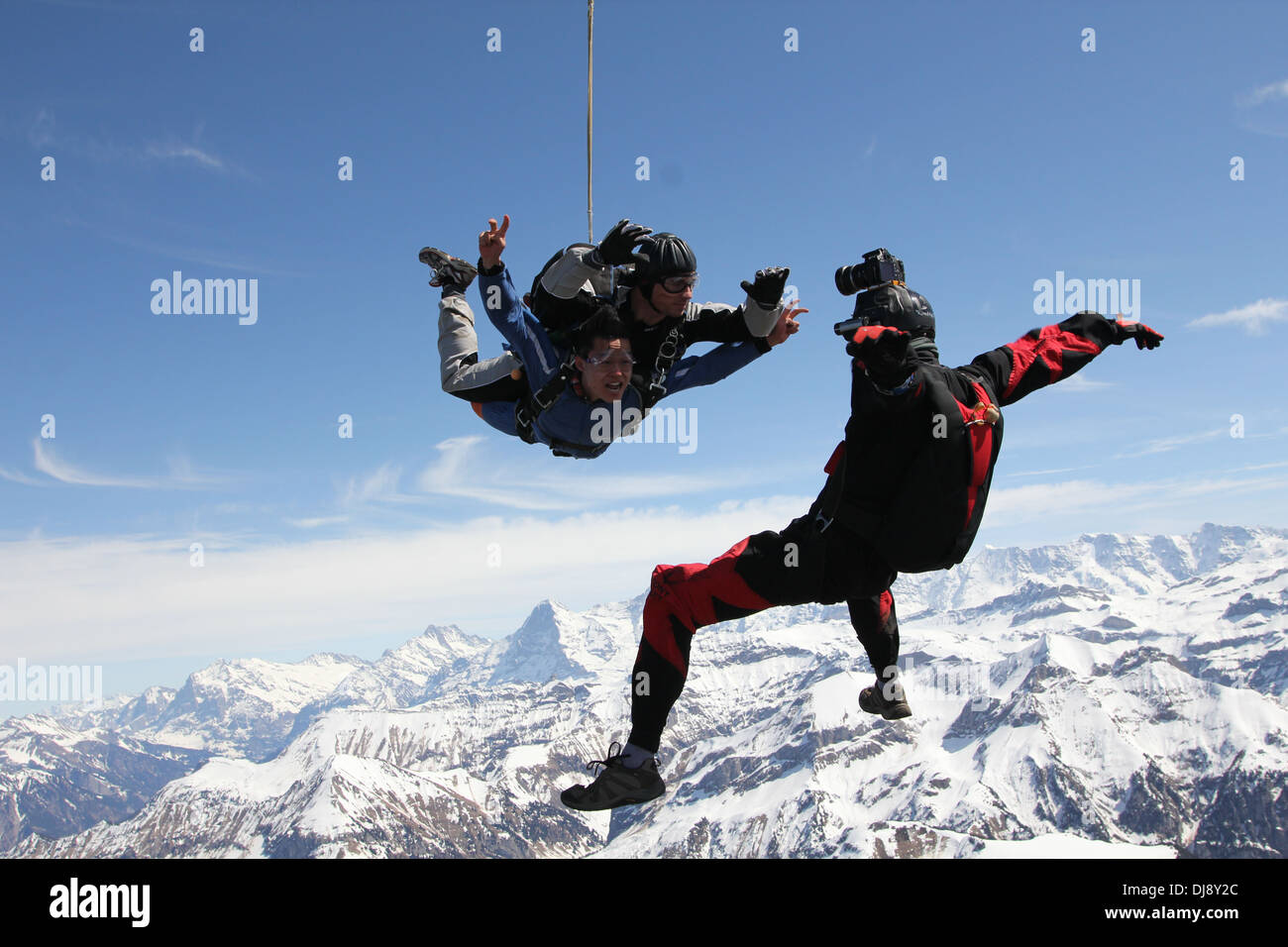 Tandem skydiving passengers is having fun during the freefall over a ...