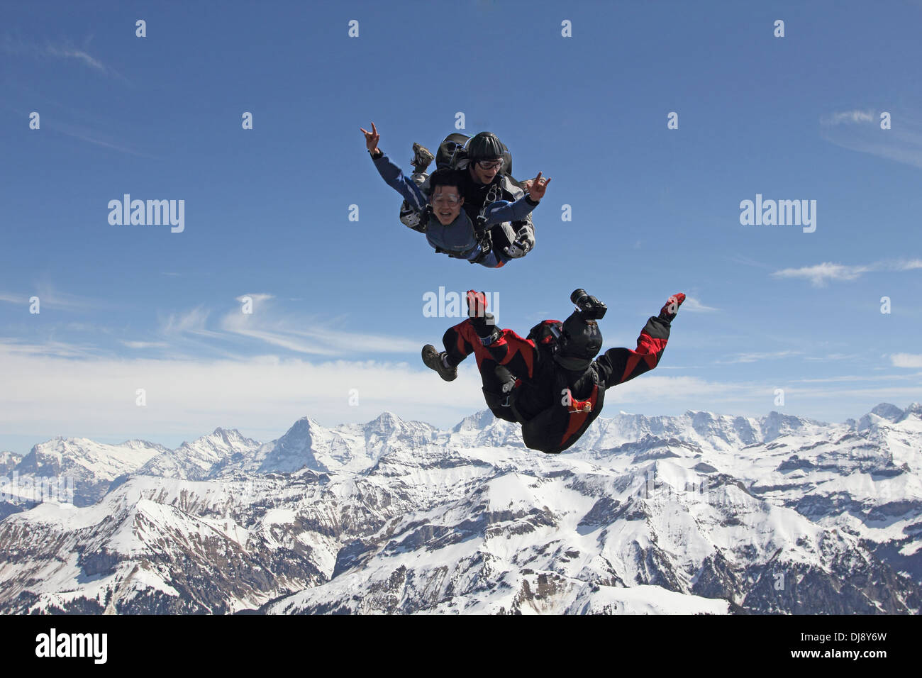 Tandem skydiving passengers is having fun during the freefall over a ...