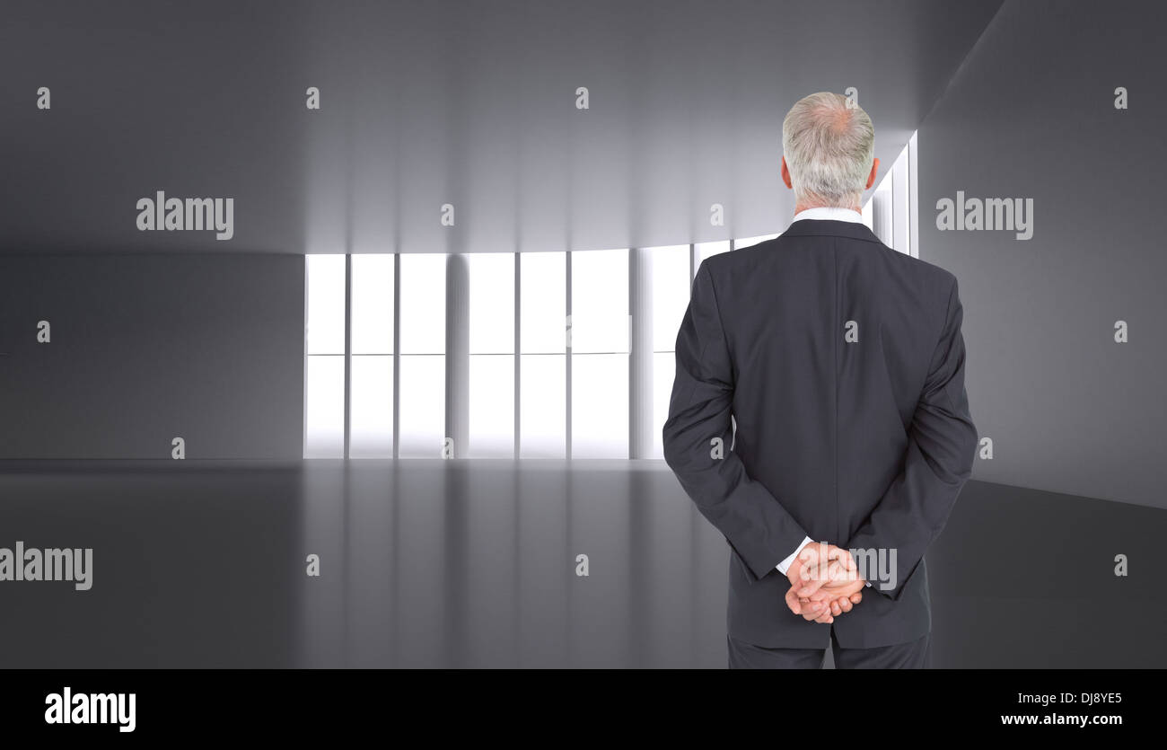 Rear view of serious businessman posing Stock Photo - Alamy
