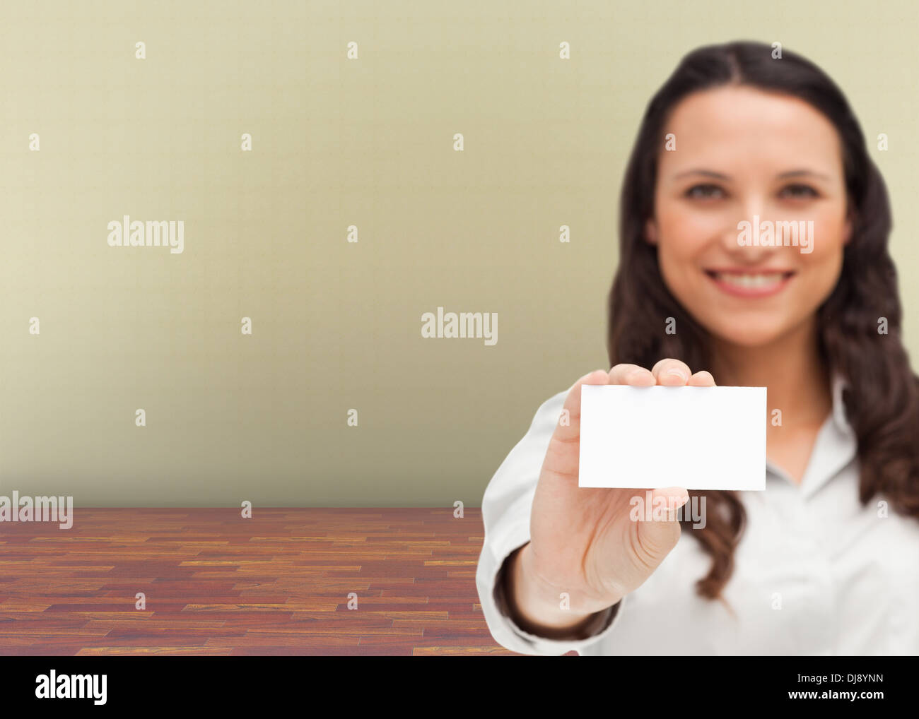 Brunette model showing a card Stock Photo - Alamy