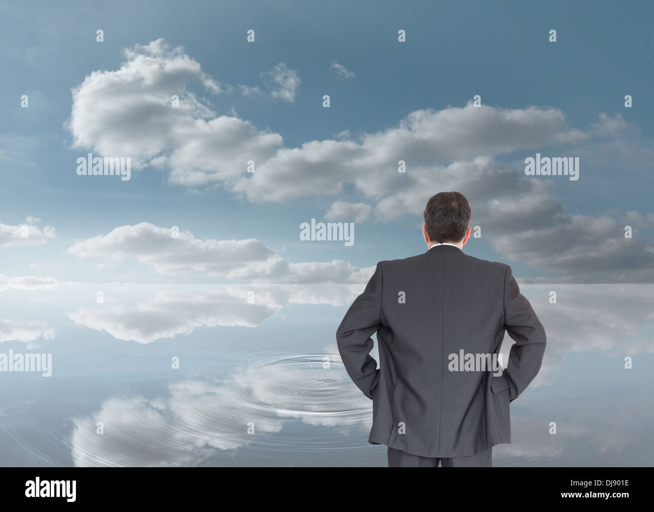 Businessman standing back to the camera with hands on hip Stock Photo ...