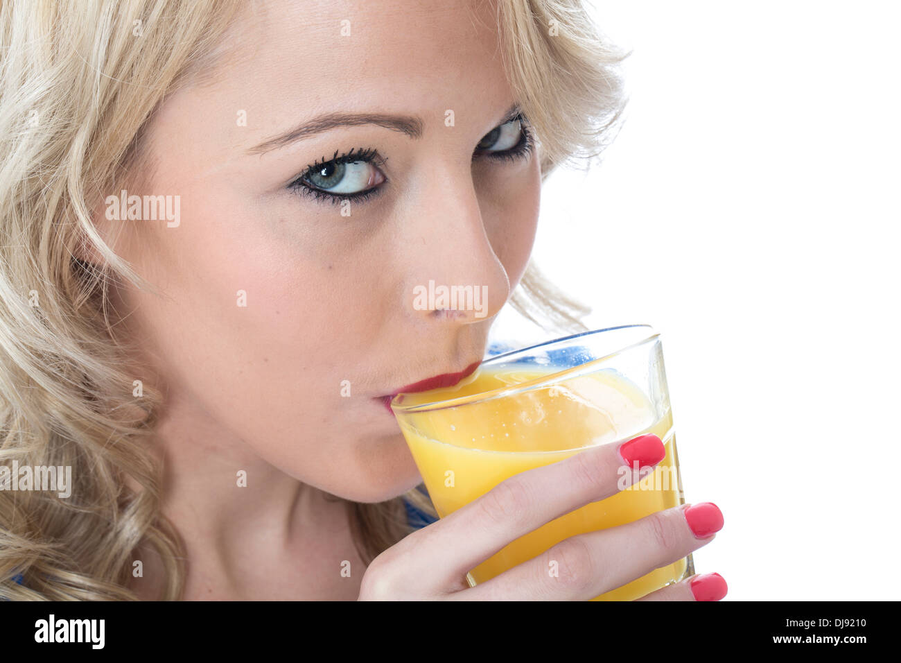 Model Released. Attractive Young Woman Drinking Orange Juice Stock ...