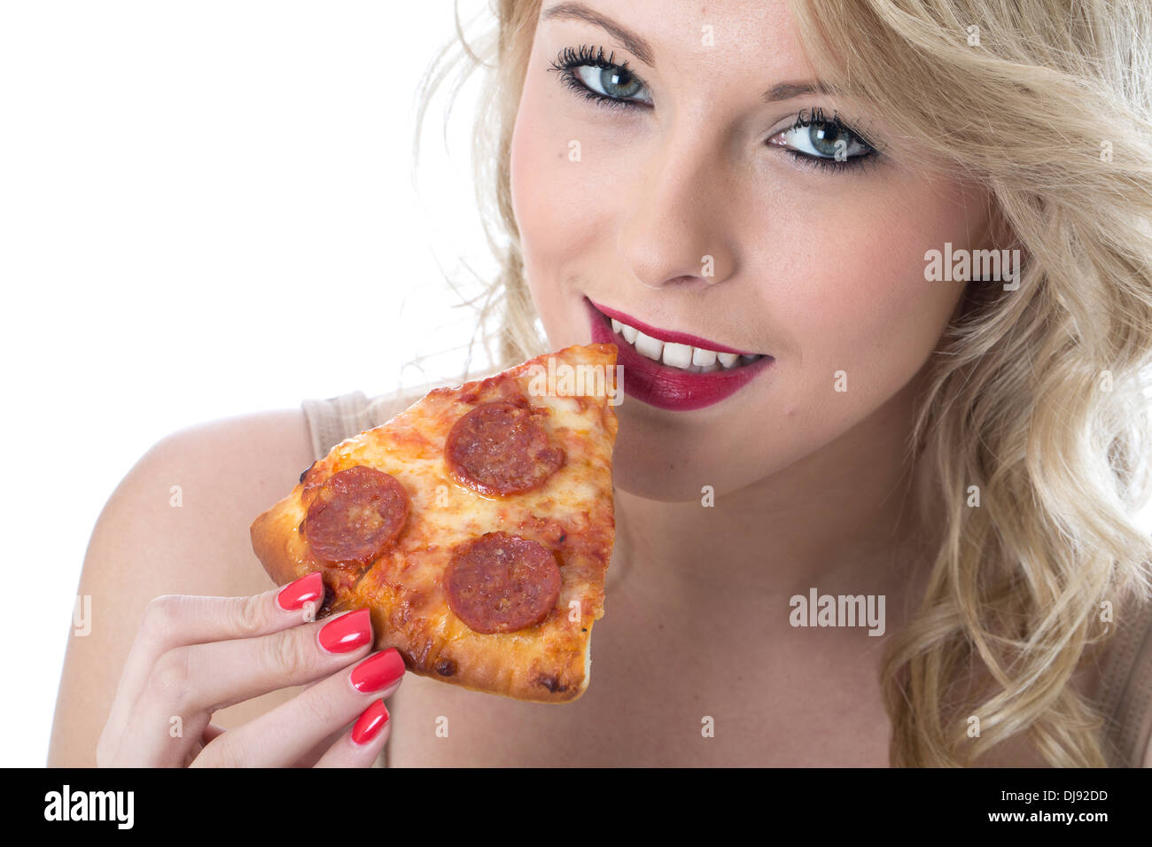 Model Released. Attractive Young Woman Eating Pizza Stock Photo - Alamy