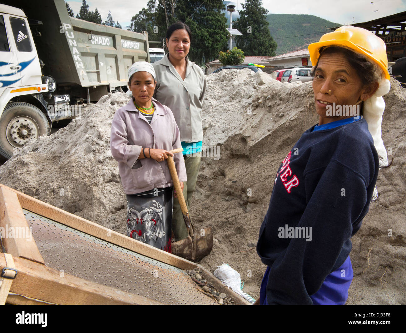 Bhutan, Wangdue Phodrang, house construction, women labourers sieving ...