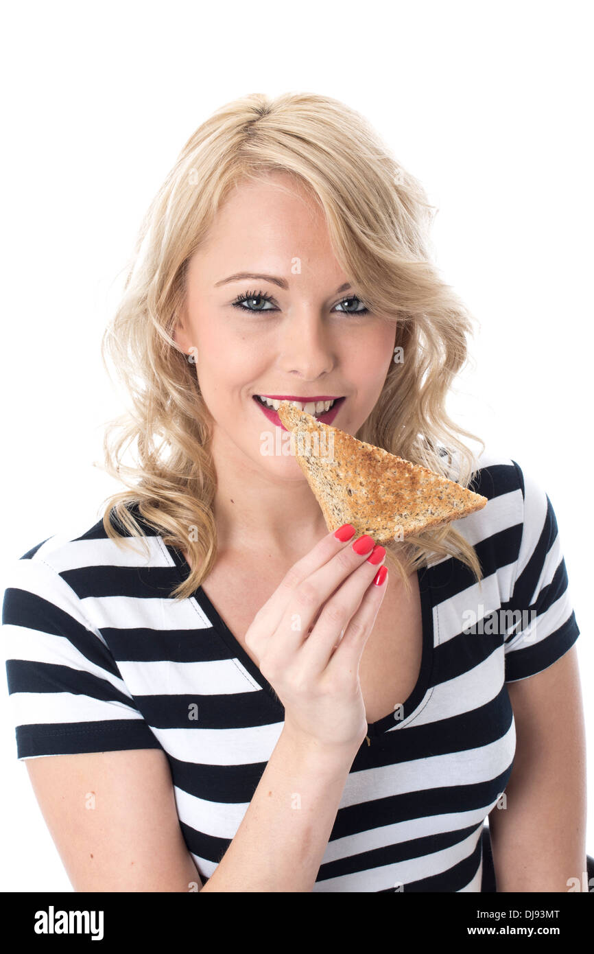 Model Released. Attractive Young Woman Eating a Slice of Toast Stock ...
