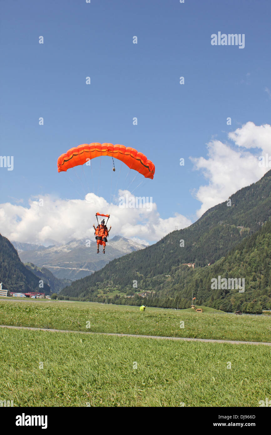 Skydiver under canopy is approaching the landing area after a fun ...