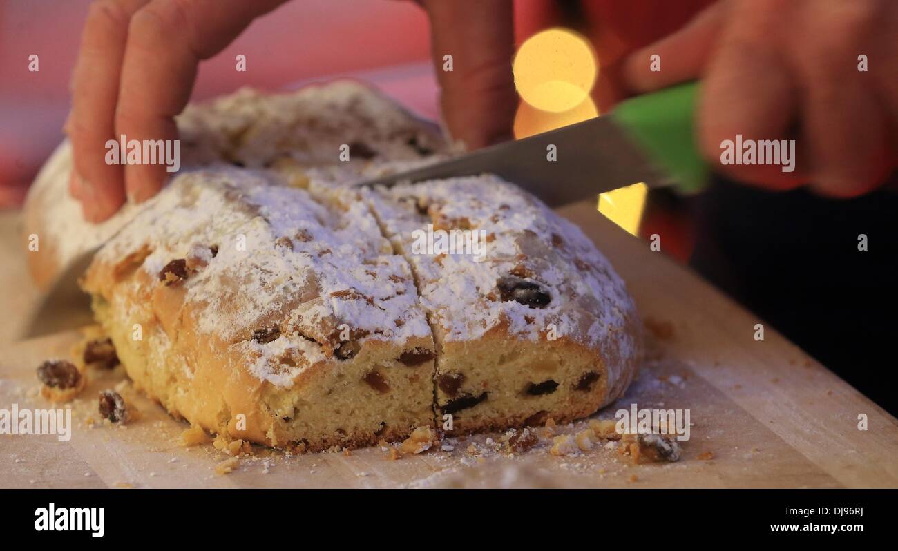 Magdeburg, Germany. 25th Nov, 2013. A stollen is cut in Magdeburg ...