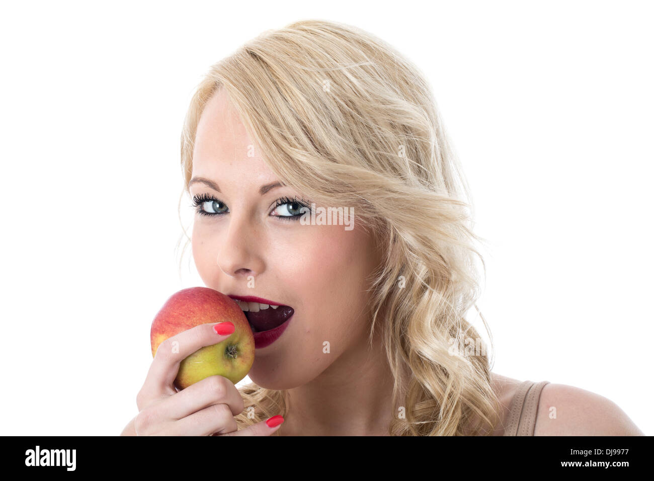 Model Released. Attractive Young Woman Eating a Red Apple Stock Photo ...