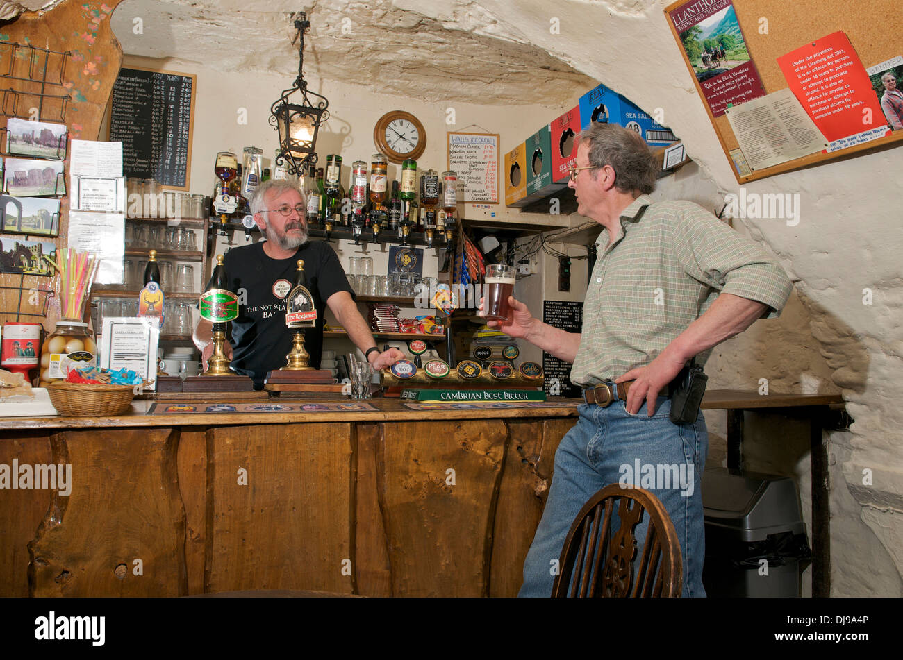 Small tiny pub bar customer drinking pint publican local hi-res stock ...