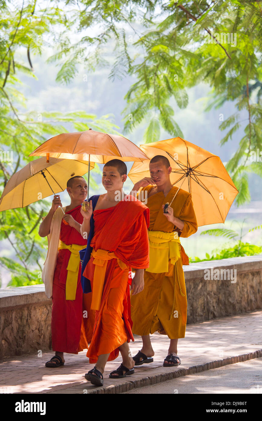 Novice monks with parasol hi-res stock photography and images - Alamy