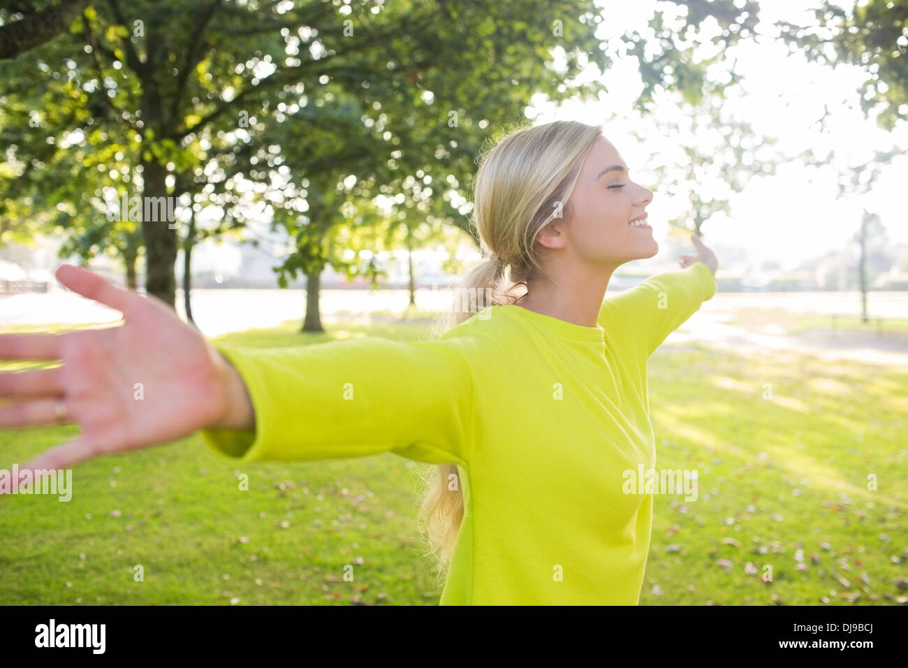Fit smiling blonde enjoying the sun Stock Photo - Alamy