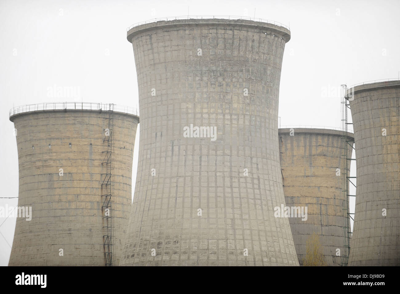 Four power plant cooling chimneys Stock Photo - Alamy