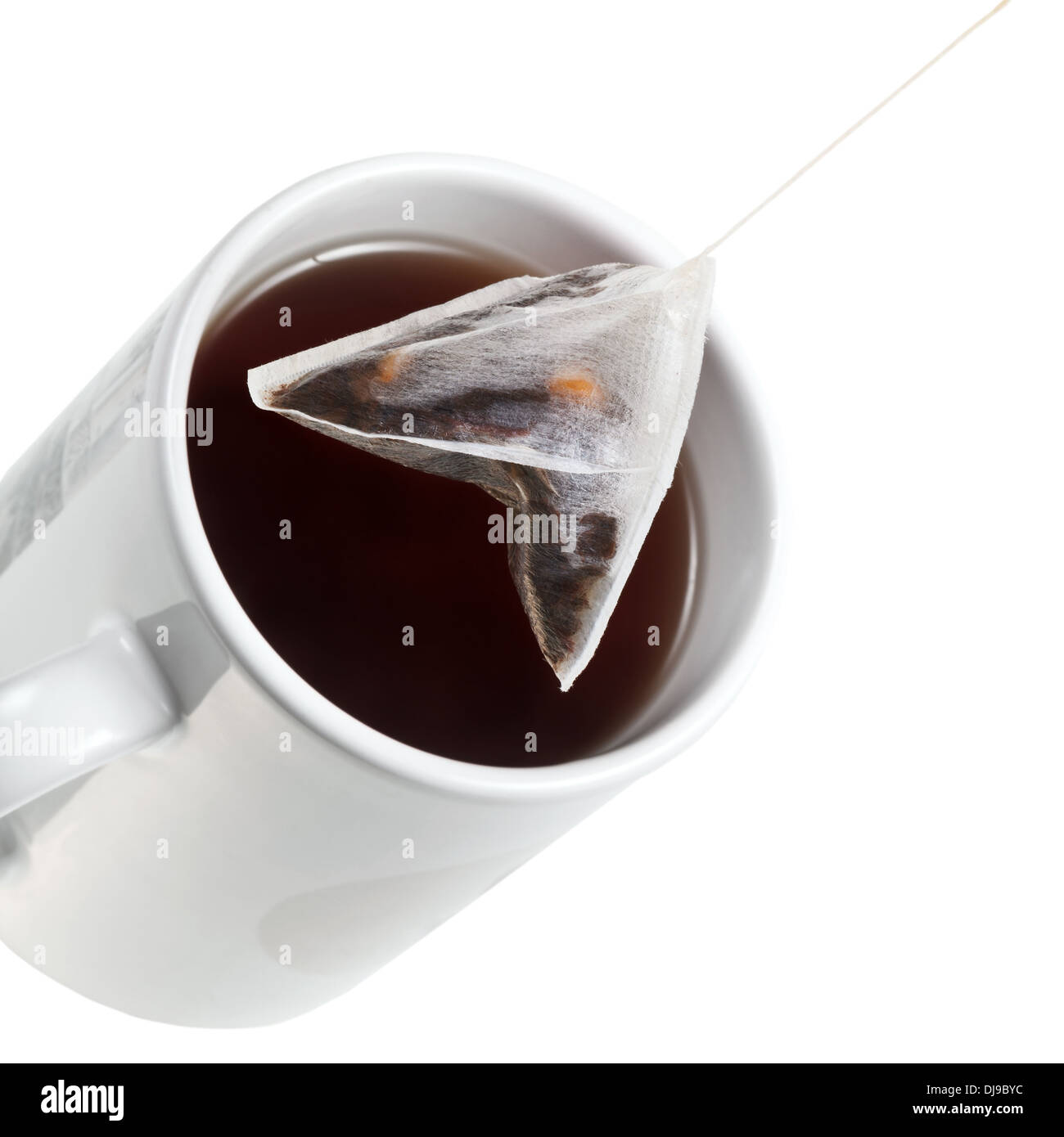 mug with brewing tea and tea bag close up isolated on white background ...