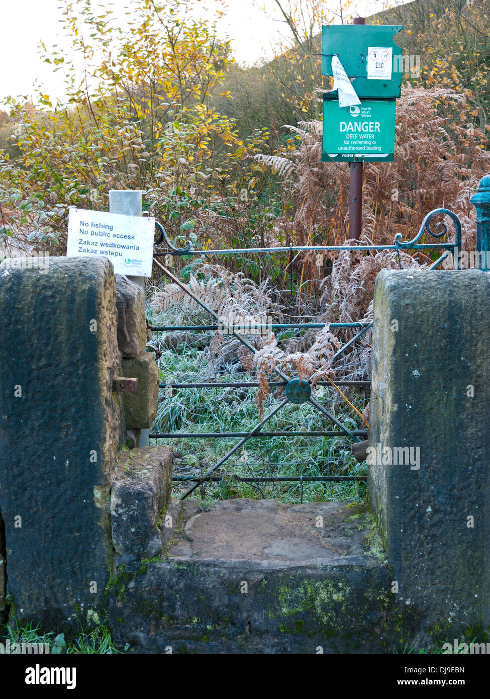 Stone entrance with metal gate at Walkerwood Reservoir, Stalybridge ...