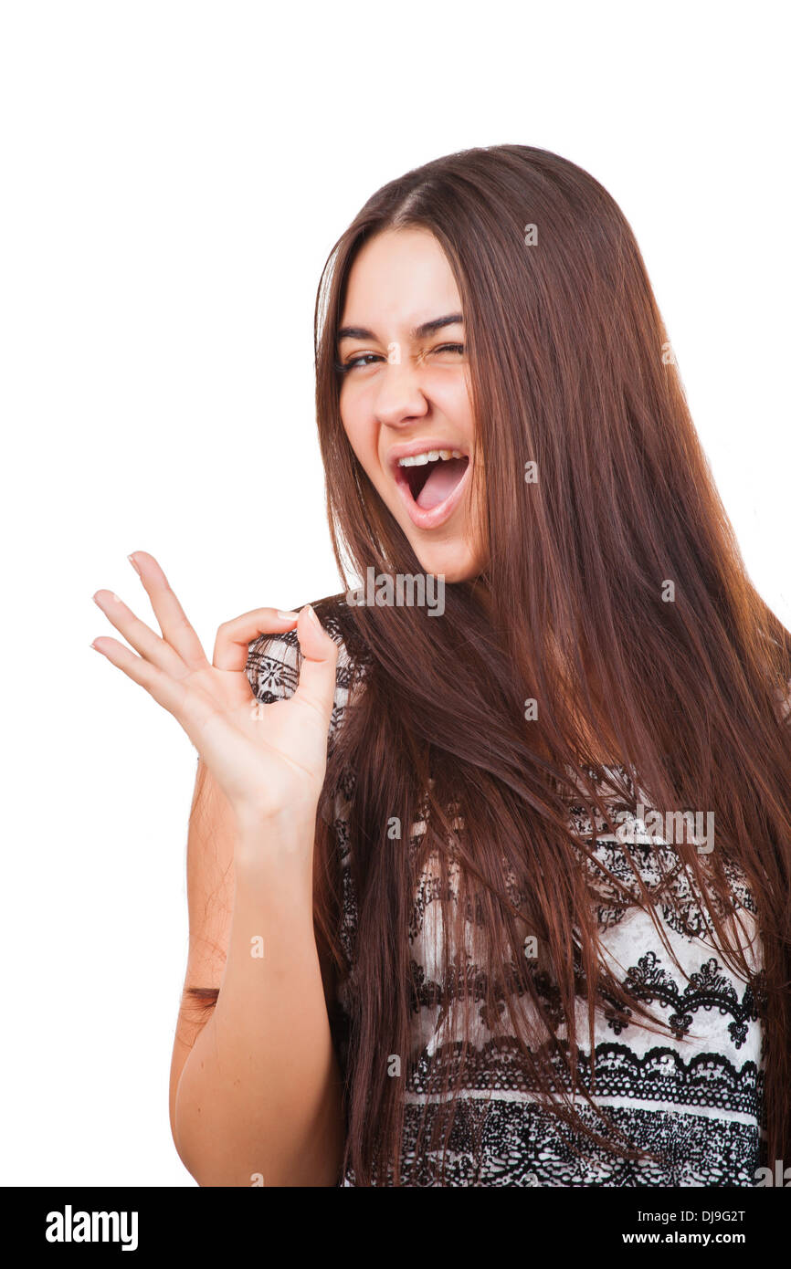 Attractive young woman showing ok sign in studio Stock Photo - Alamy
