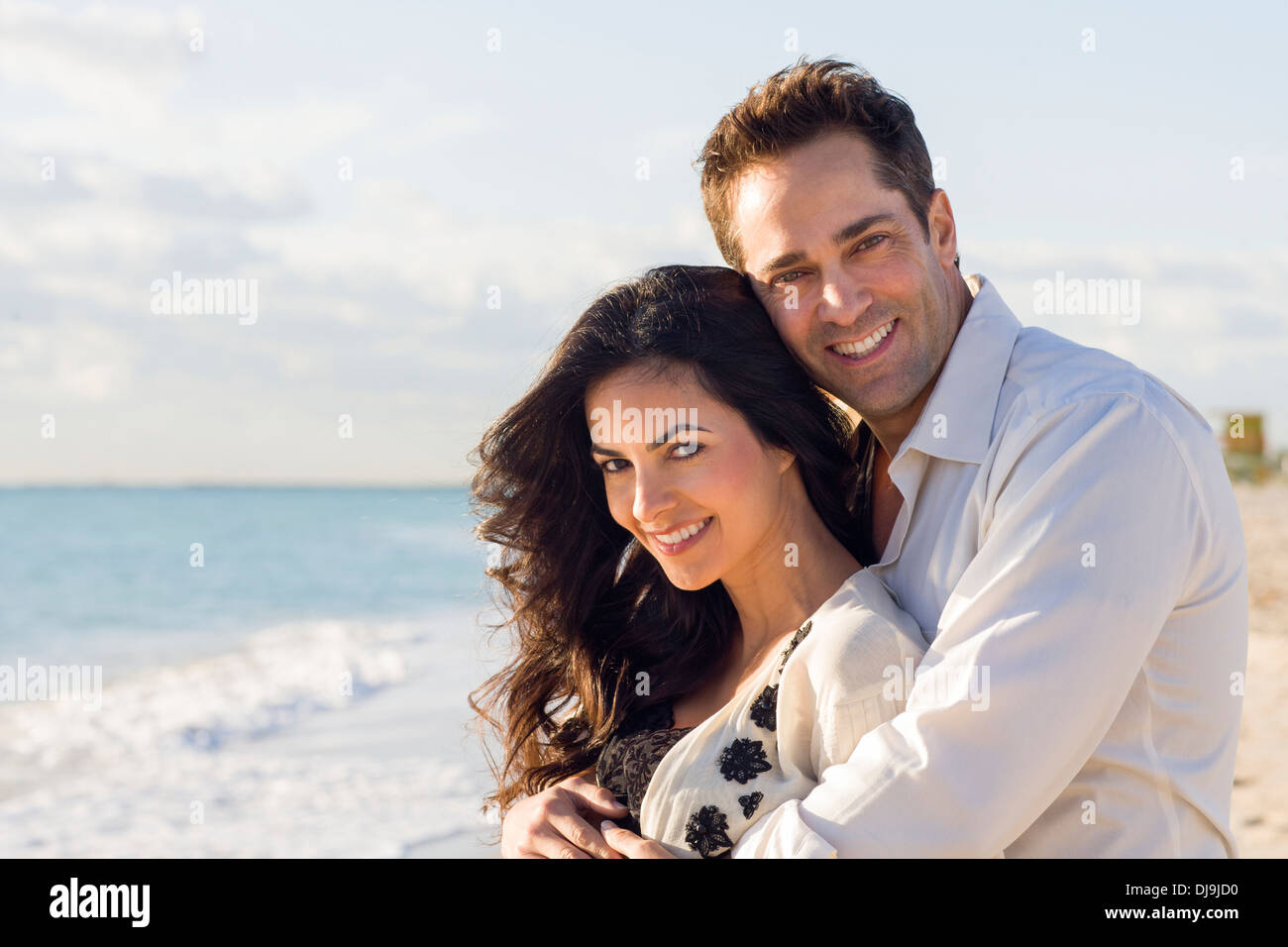 Couple on beach camera hi-res stock photography and images - Alamy