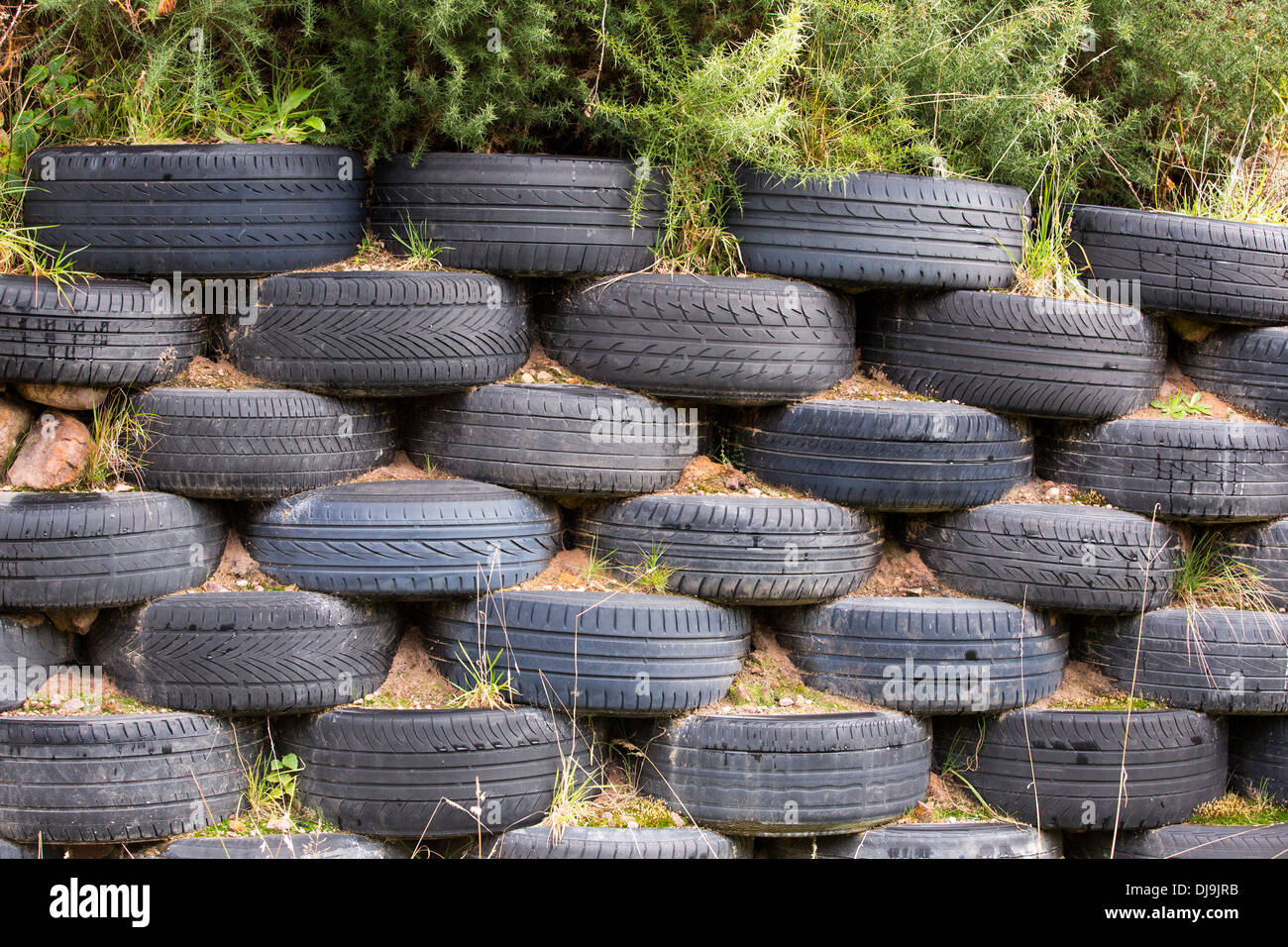 A recycled tyre wall in Scoraig, in NW Scotland, one of the most remote ...