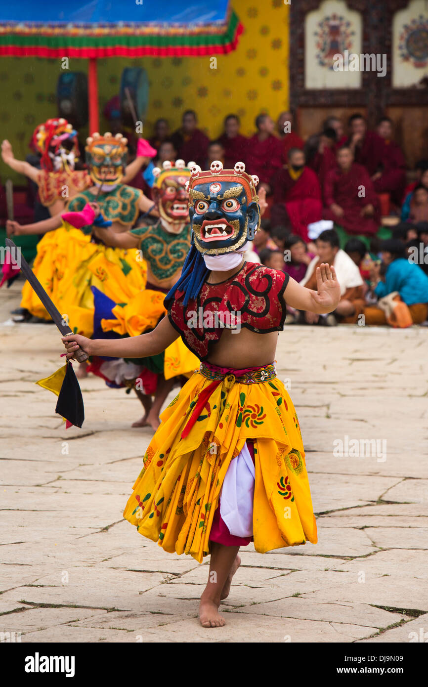 Bhutan, Phobjika, Gangte Goemba Tsechu, masked festival dancer carrying ...