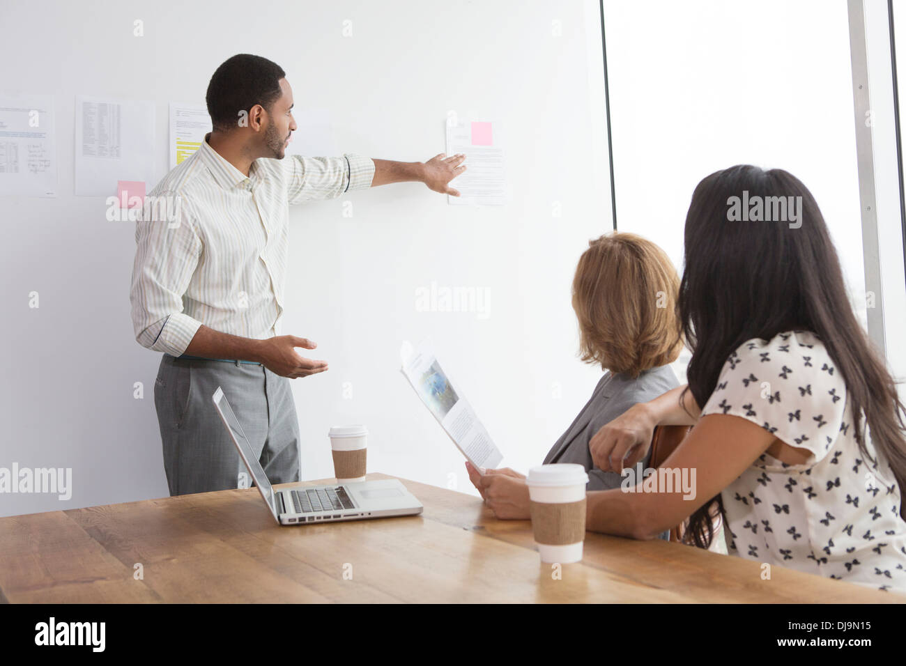 Business people talking in meeting Stock Photo - Alamy