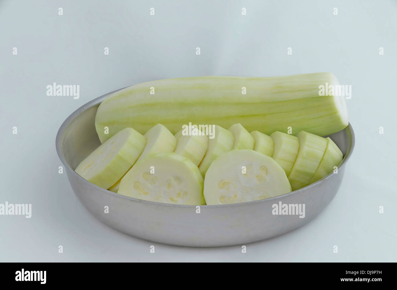 Vegetable marrow at slice in metal vessel Stock Photo - Alamy