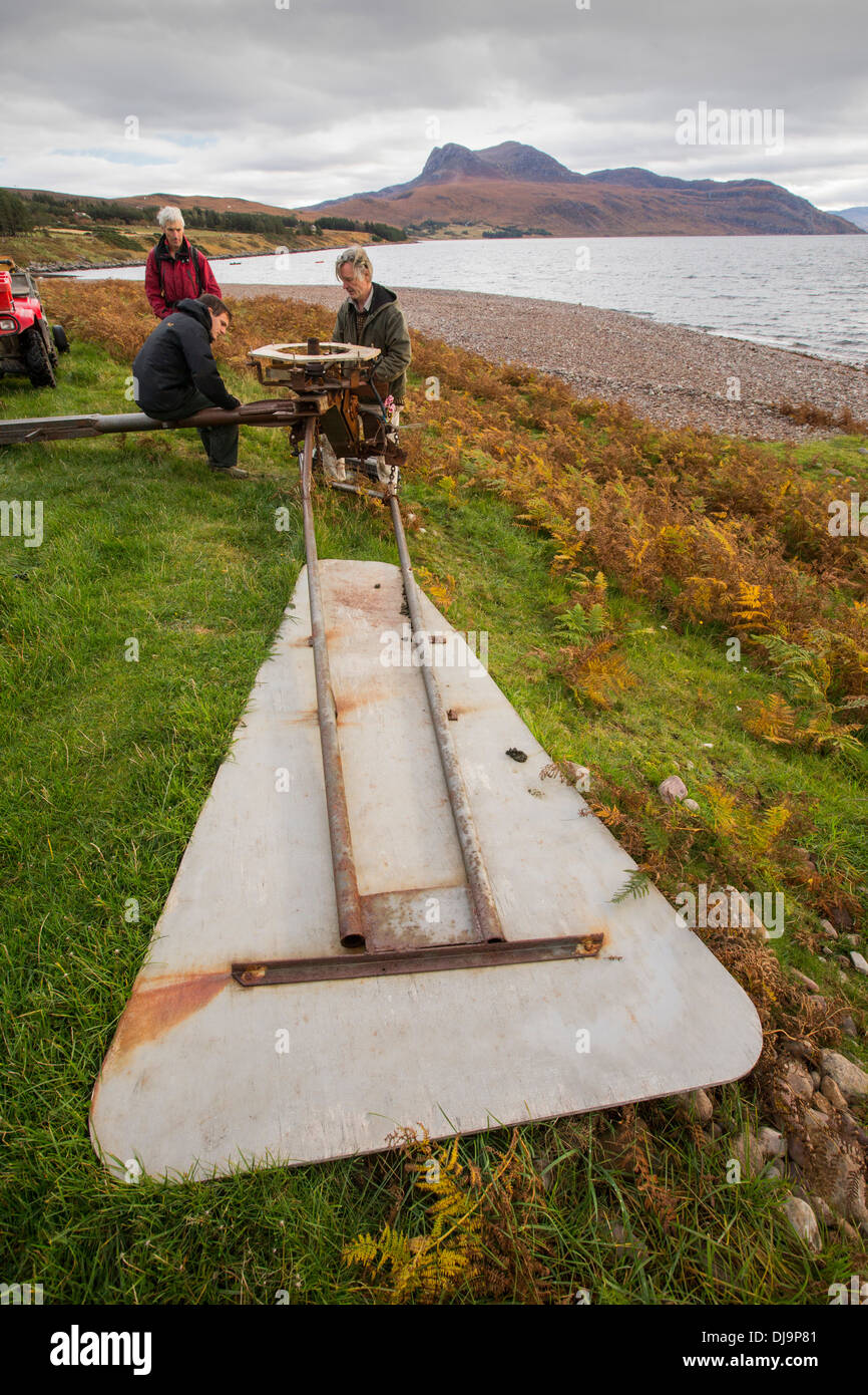 Hugh Piggott doing maintenance on his home made wind turbines in ...