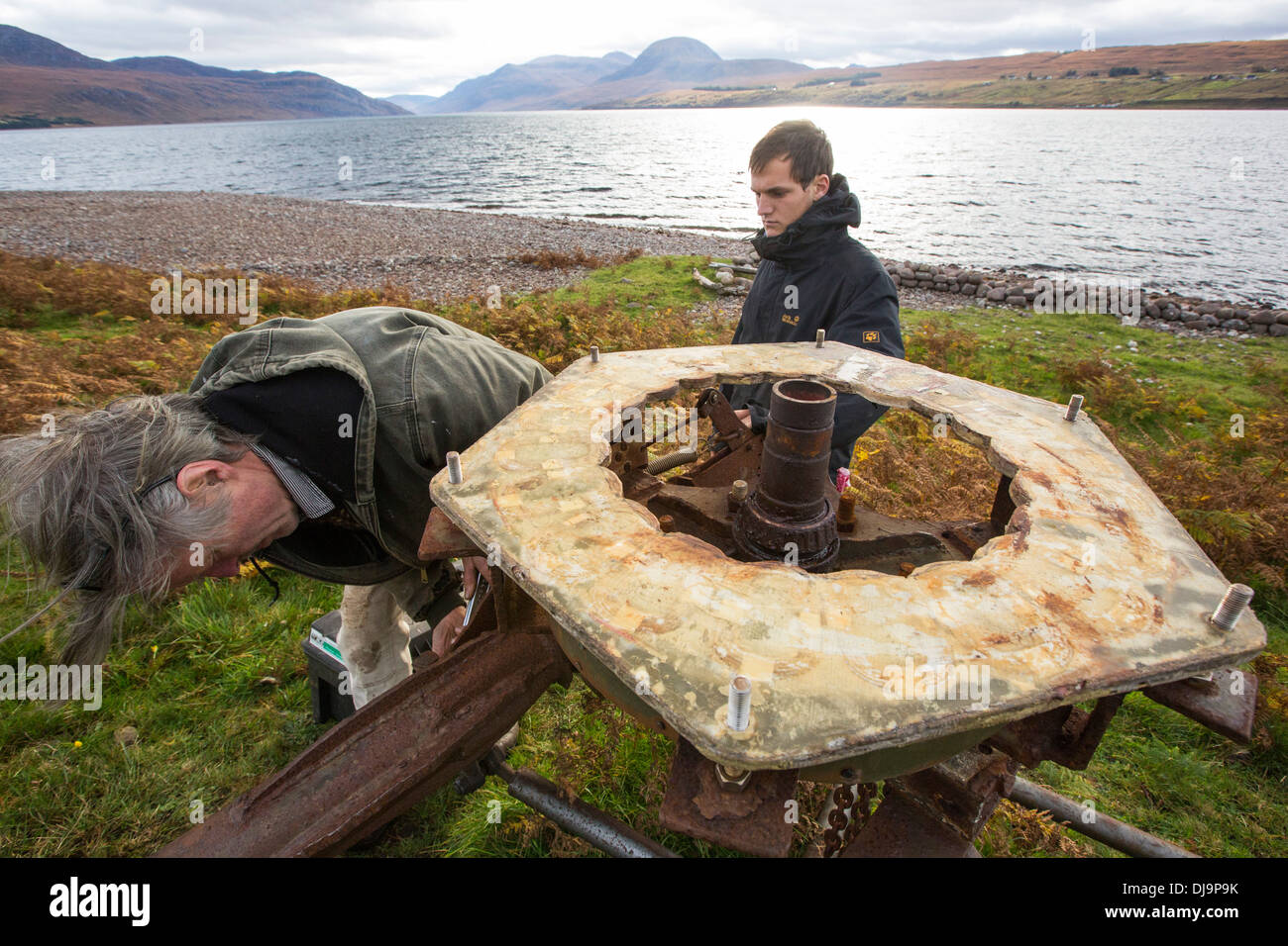 Hugh Piggott doing maintenance on his home made wind turbines in ...