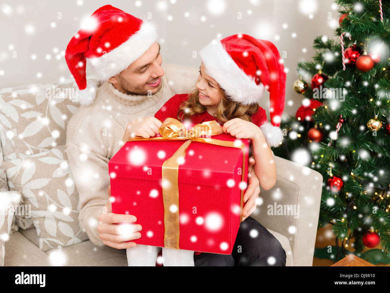 smiling father and daughter opening gift box Stock Photo - Alamy